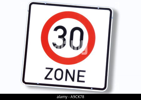 Closeup shot of a sign indicating the speed limit of 55 on a blurred ...