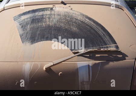 A HEAVY LAYER OF DUST ON THE BACK WINDSCREEN OF A CAR OUTBACK AUSTRALIA ...