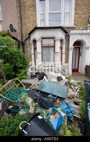Front garden full of rubbish outside private residential housing ...
