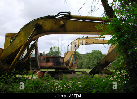 abandoned rusting road diggers in countryside Stock Photo - Alamy