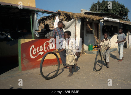 Children rolling tires Stock Photo - Alamy