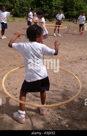 Children playing outside with plastic hula hoops Stock Photo - Alamy