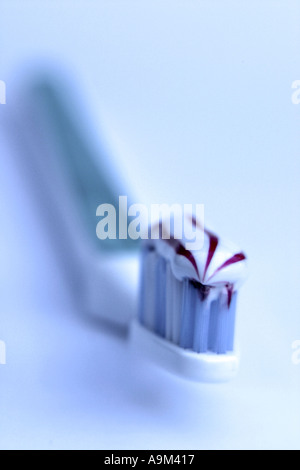 Toothbrush and Stripy Toothpaste Stock Photo - Alamy