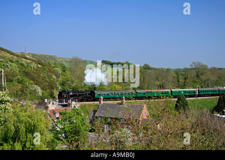 Swanage steam railway train arriving in Corfe Castle railway station ...