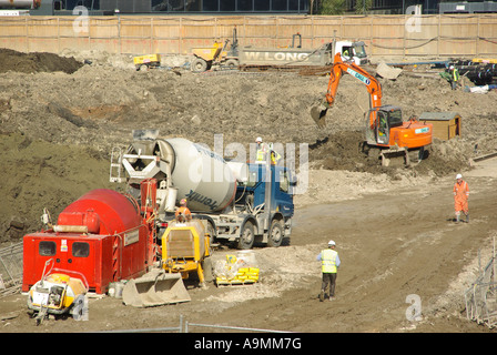 Ready mixed concrete lorry unloading into ground floor slab onto black ...