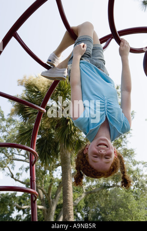 Image of redhead excited girl laughing and looking at camera isolated over yellow background ...