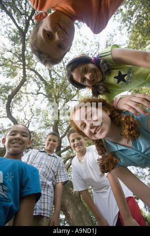 Low angle view of girls standing against window Stock Photo - Alamy