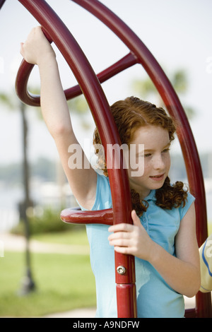 Image of thoughtful redhead girl looking at upper left corner, thinking ...