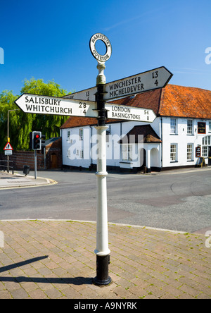 Overton village centre, Hampshire, England, UK, with a family walking ...