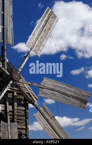 The wooden blades of historic log windmill, decorated with the wooden ...