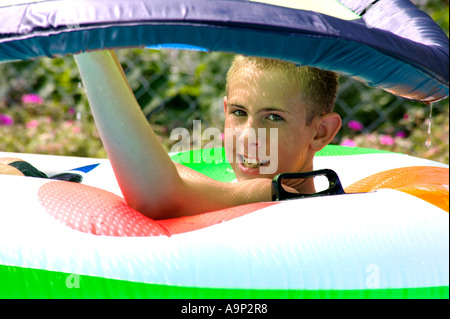 Young Boy Playing with Inner Tubes on a Beach, Toronto, Ontario Stock ...