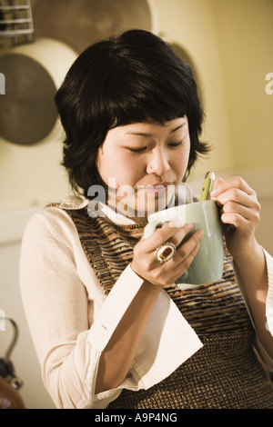 selective focus, kitchen utensils, black round plate with a black fork ...