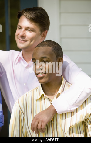 Two young men standing together Stock Photo - Alamy