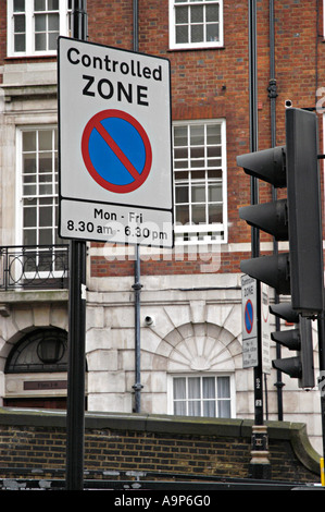 Controlled zone sign on London Bridge over the river Thames leading ...