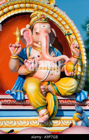 hindu god ganesha idol worshiped with flowers vertical shot from flat ...