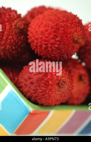 Red lichees on white background Stock Photo - Alamy
