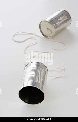 Two connected cans Stock Photo - Alamy