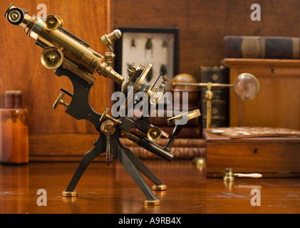 Old fashioned microscope on table Stock Photo - Alamy