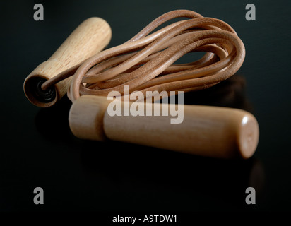 Leather jumping rope over black background Stock Photo - Alamy