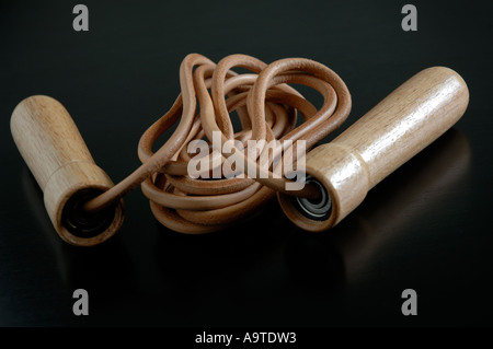 Leather jumping rope over black background Stock Photo - Alamy