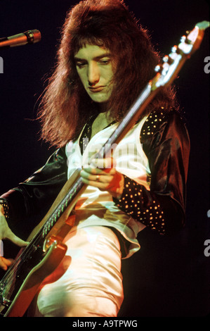 Queen Rock Group John Deacon playing bass guitar Queen in concert at ...