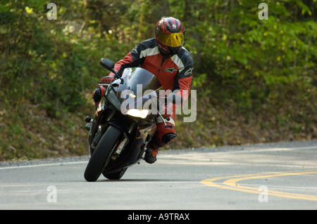 motorcycle being ridden on a rural road Stock Photo - Alamy