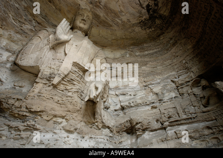 Weather beaten stone statues at an archaeological site in the village ...