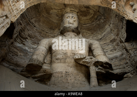 Weather beaten stone statues at an archaeological site in the village ...