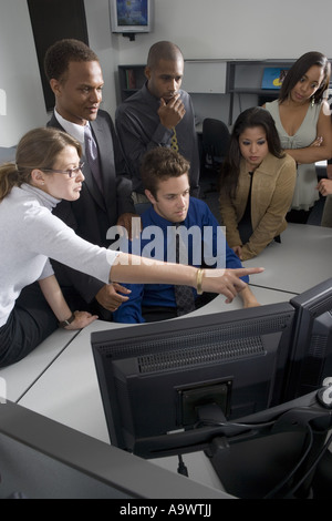 People standing around office cubicles in discussion Stock Photo ...