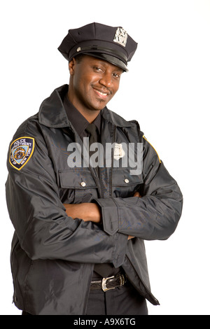 a friendly looking police officer smiles and stands next to her patrol ...
