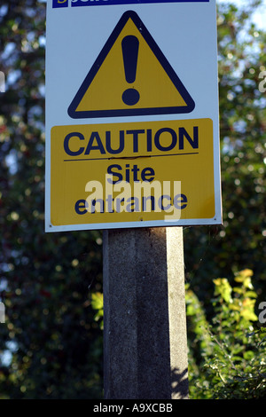 Caution Site Entrance notice Stock Photo - Alamy