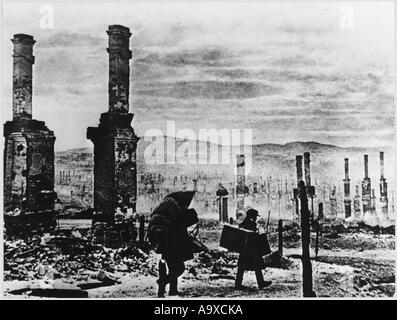 World War 2, Ruins of Murmansk in 1942. Soviet woman carrying large ...