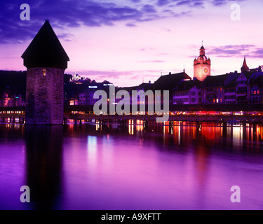 Chapel Bridge and Water Tower illuminated at dusk on the Reuss River ...