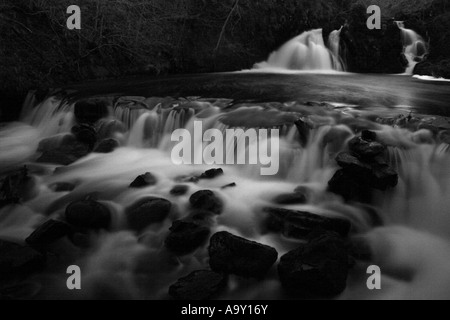 Water streams down a small scottish burn capturing the motion using a ...