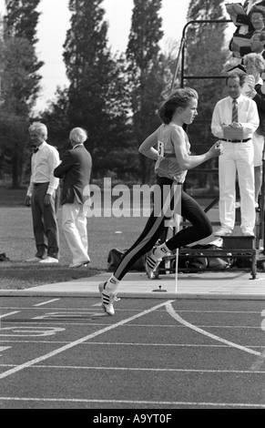 Young girl winning sprint race on school sports day Chipping Campden UK ...