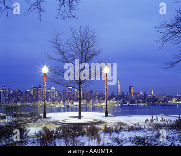 Festival of lights in city park, pond fire along coast with people ...