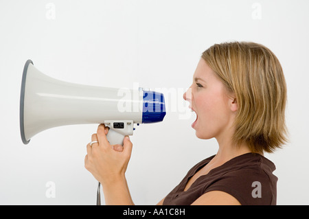 Woman using loudspeaker Stock Photo - Alamy