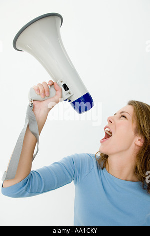 Woman using loudspeaker Stock Photo - Alamy