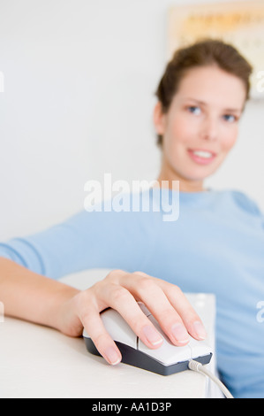 Business woman using computer mouse and keyboard Stock Photo - Alamy