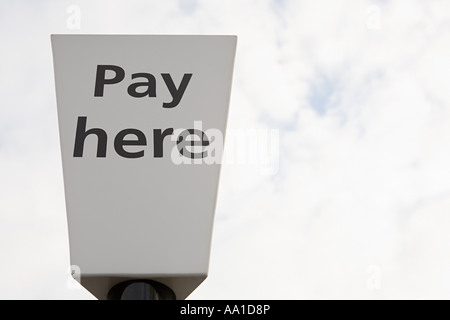 Pay here sign Stock Photo - Alamy