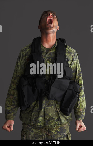 Mad army soldier screaming while looking at camera Stock Photo - Alamy