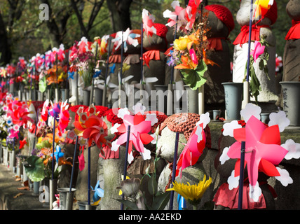 A colourful Japanese shrine with miniture windmills and decoration ...