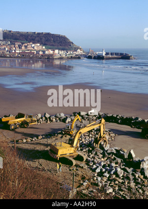 Placing boulder protection to the base of a cliff, Scarborough, North ...