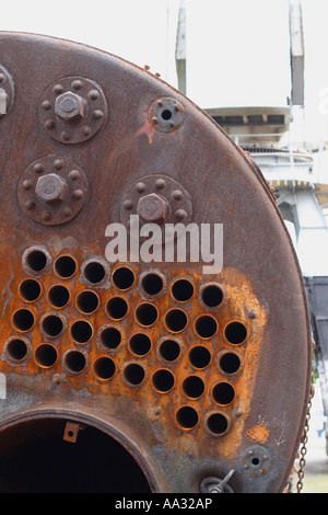 Old rusty boiler scrap metal on rocky terrain Stock Photo - Alamy