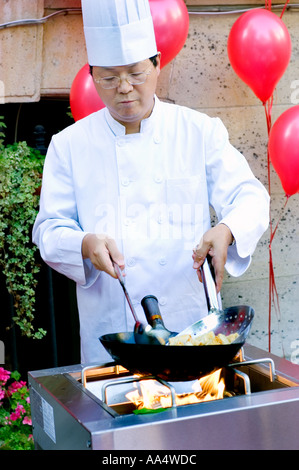 Mature Asian Chinese chef giving thumb up Stock Photo - Alamy
