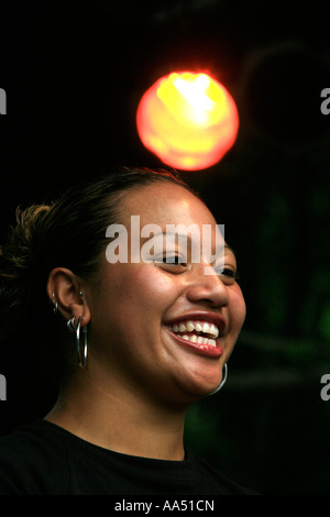 A smiliing Maori women singing during a Matariki festival in the Hawkes ...