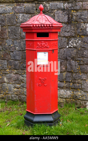 A red Victorian postbox outside the town hall in the historic city of ...