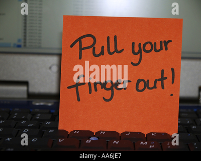 Memo note on notebook, pull your finger out Stock Photo - Alamy