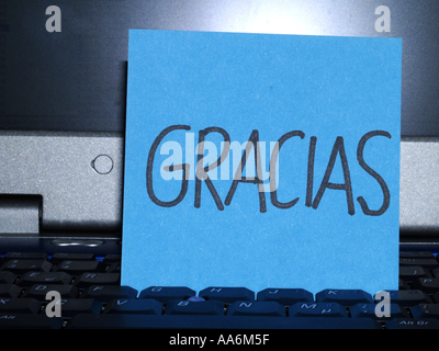 Memo note on notebook, gracias, thanks Stock Photo - Alamy