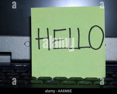 Memo note on notebook, hello Stock Photo - Alamy